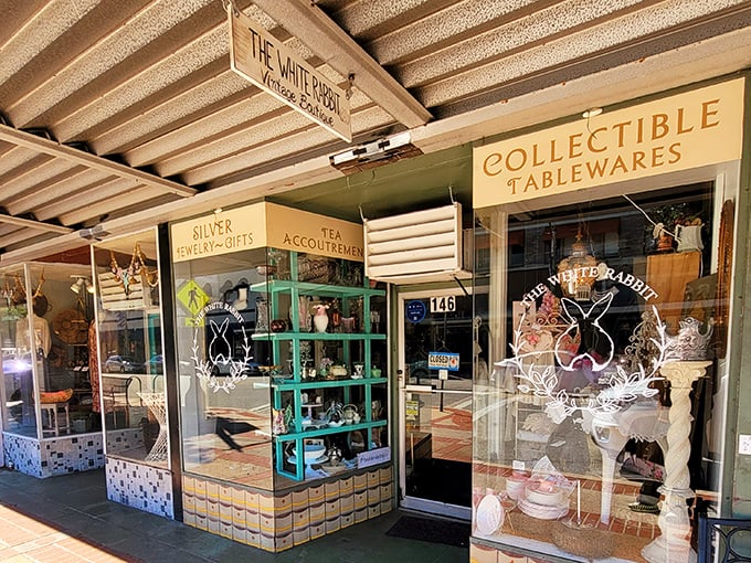 The storefront beckons like a vintage postcard come to life, with its charming signage promising treasures organized by category&mdash;silver, tea, and collectible tablewares await!