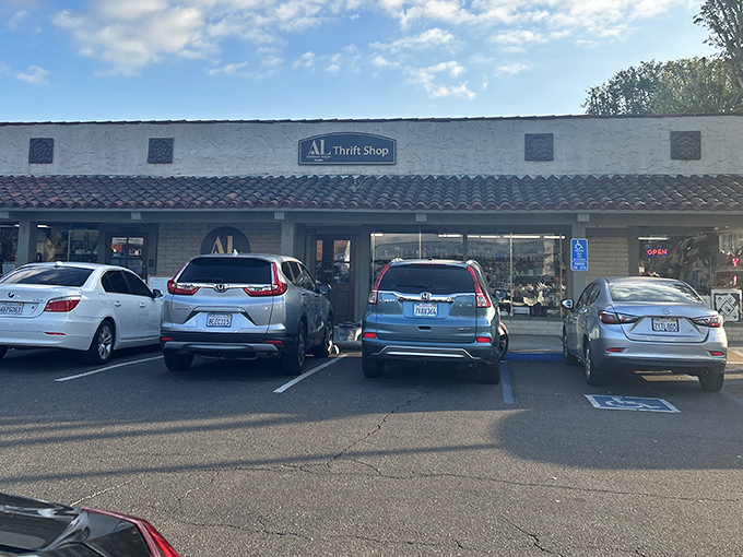 The unassuming storefront of Assistance League of Tustin Thrift Shop – where treasure hunting begins beneath that classic Spanish-style roof.