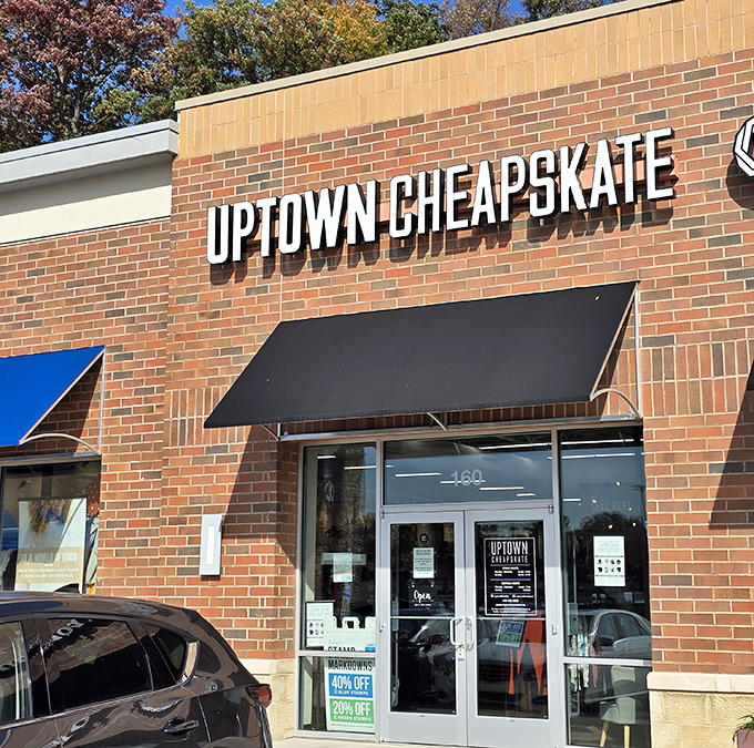 The brick facade of Uptown Cheapskate in Ellicott City promises treasure hunting without the usual thrift store treasure map. Fashion gold awaits inside!