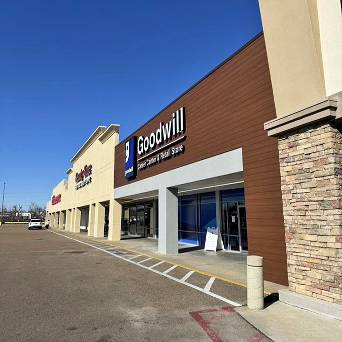 The blue-trimmed entrance to Goodwill on I-55 feels like a gateway into a world where hidden gems are waiting to be found.