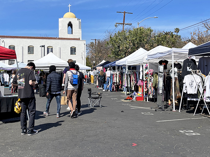 White tents line the pathway like a treasure map, guiding shoppers through a sea of vintage finds and handcrafted gems at Silverlake Flea.