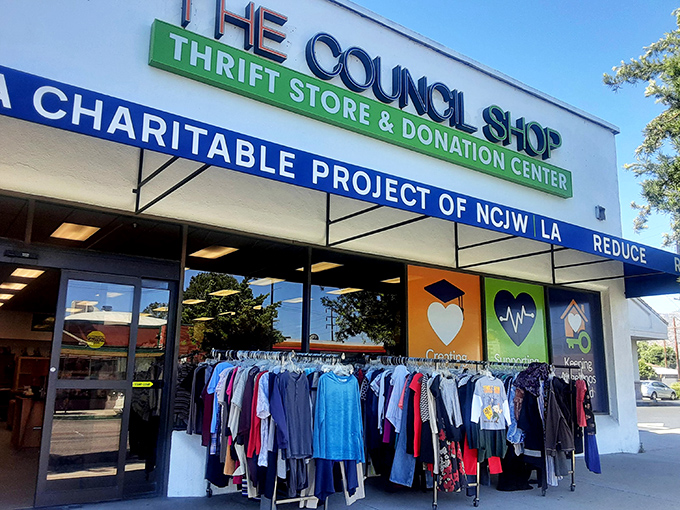 The Council Shop's welcoming facade promises treasure hunting adventures with racks of clothing already tempting passersby on Magnolia Boulevard. 