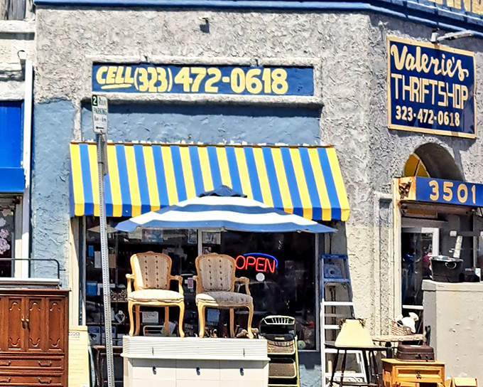 The iconic blue and yellow sign of Valerie's Thrift Shop beckons bargain hunters like a beacon of affordable possibility in Los Angeles.