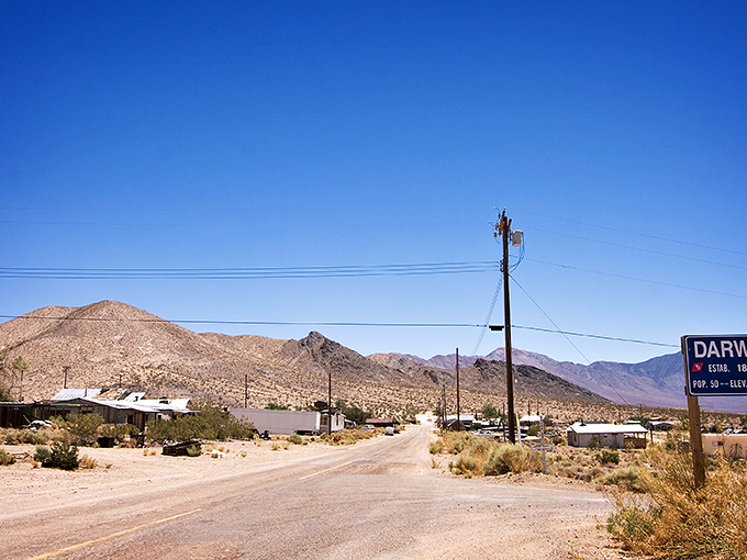 Welcome to Darwin, where the road sign might be the most populated spot in town. Those mountains aren't just scenery&mdash;they're neighbors.