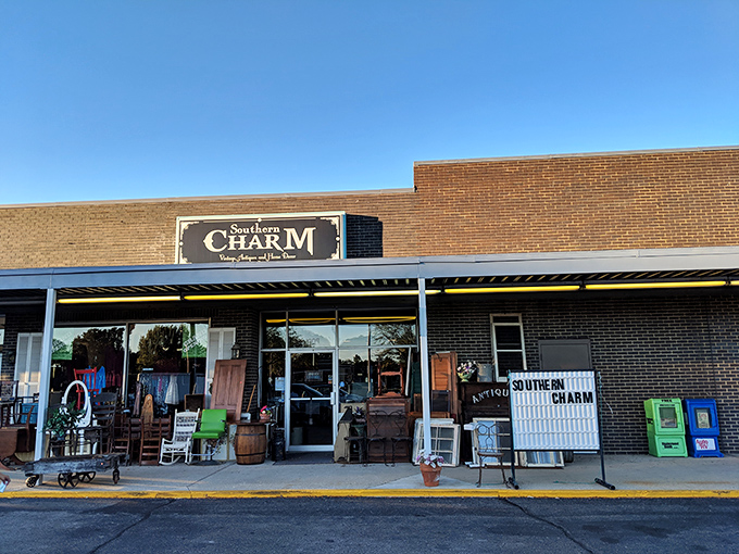 Southern Charm's welcoming storefront spills onto the sidewalk, a preview of treasures awaiting inside. The vintage porch furniture practically begs you to sit a spell.