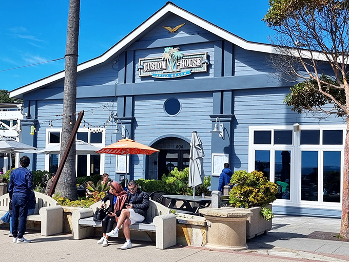 The blue-hued Custom House stands like a maritime postcard come to life, welcoming hungry travelers with the promise of ocean-fresh delights.