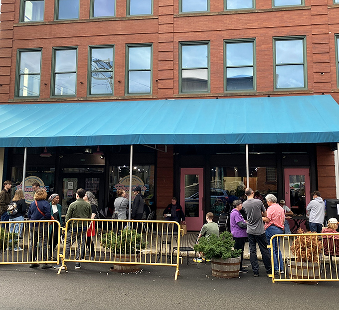 The iconic blue awning of Pamela's Diner in Pittsburgh's Strip District stands as a beacon for breakfast pilgrims seeking morning salvation.