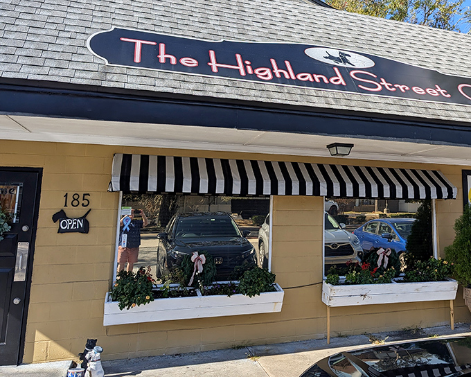The yellow facade and classic black-and-white striped awning of Highland Street Cafe isn't shouting for attention&mdash;it's confidently whispering "breakfast paradise awaits."