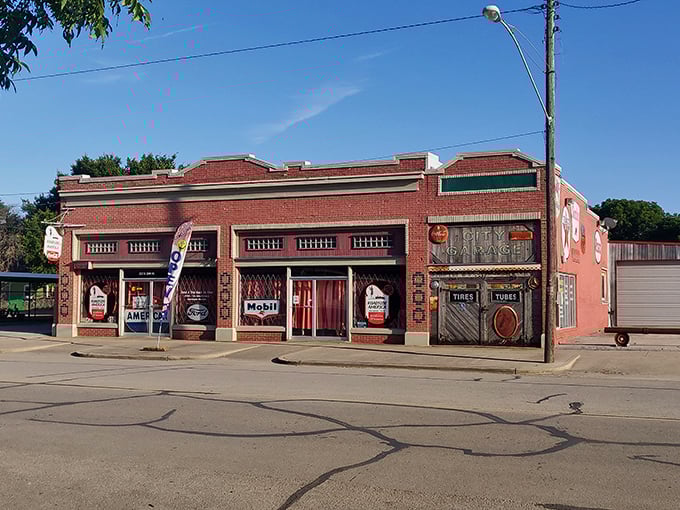 The brick facade of Roadside America Museum stands like a time portal in Hillsboro, beckoning travelers with vintage gas pumps and nostalgic charm.