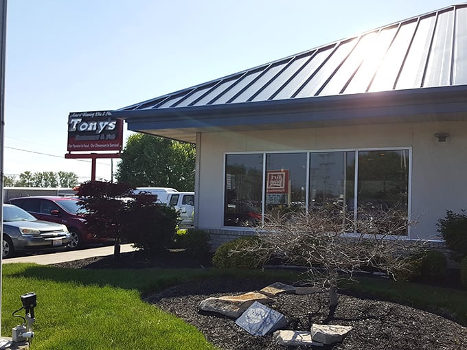 The unassuming blue-roofed exterior of Tony's might not scream "barbecue legend," but that's part of its charm. Culinary treasures often hide in plain sight.