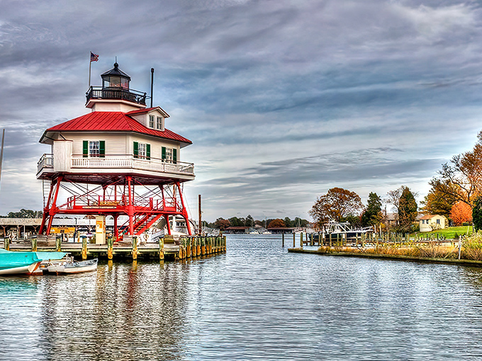 The iconic Drum Point Lighthouse stands like a maritime sentinel, reflecting perfectly in waters so calm you could practically serve dinner on them.