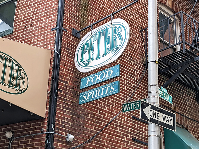 The iconic green and white sign beckons like an old friend on a Baltimore corner. Some treasures don't need neon to shine.
