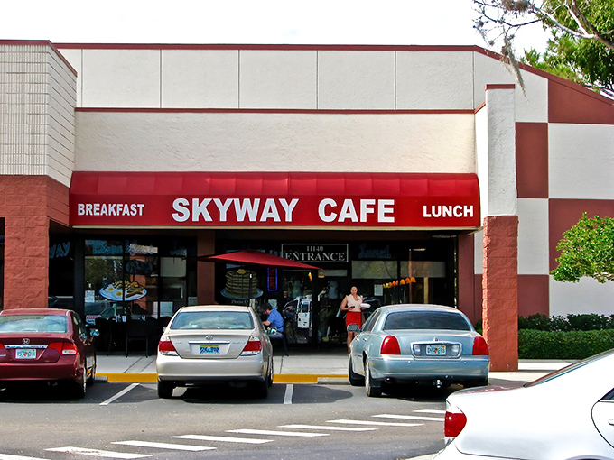 The unassuming red awning of Skyway Cafe beckons hungry travelers like a culinary control tower guiding you to breakfast bliss.