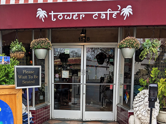 The entrance to Tower Caf&eacute; beckons like a tropical oasis in Sacramento, complete with hanging plants and a stone lion standing guard at flavor's doorstep.