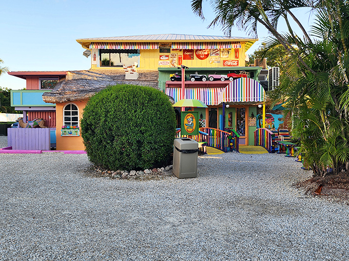 Approaching this technicolor dreamscape feels like discovering the secret hideout of a joy-obsessed artist with an unlimited paint budget.