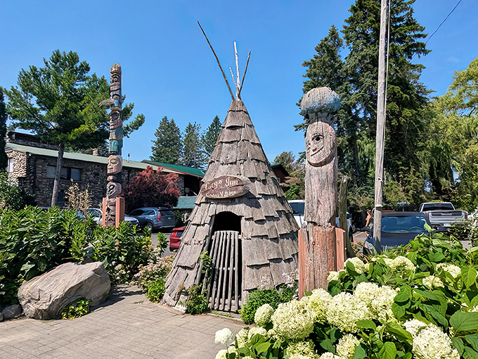 Your GPS might question your sanity, but those towering wooden totems confirm you've found Michigan's most wonderfully eccentric dining destination.