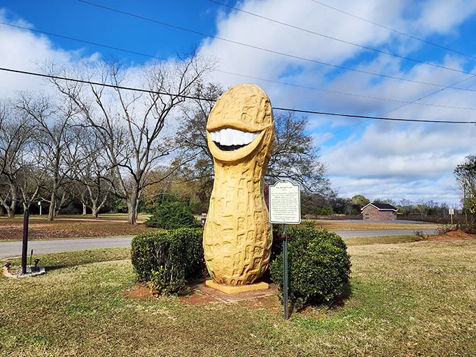 The world's most cheerful legume stands proudly against the Georgia sky, greeting visitors with a smile that could brighten even the cloudiest day.