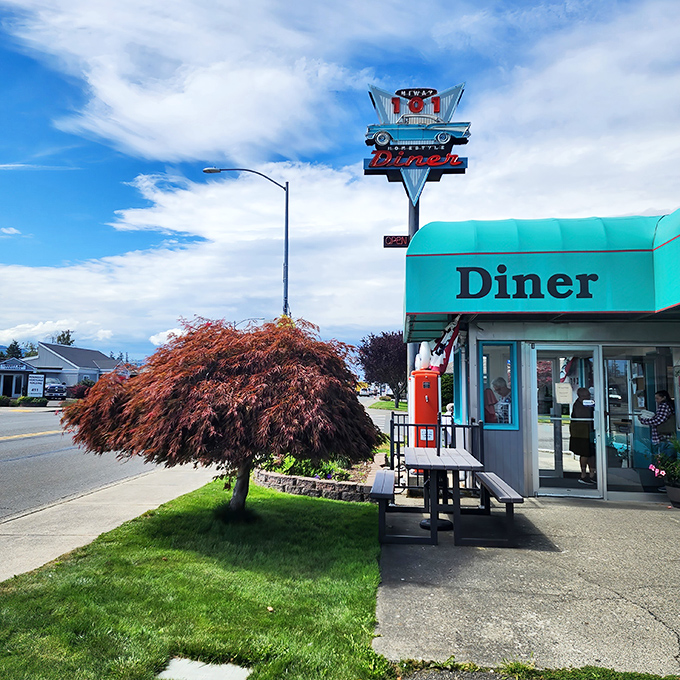 That iconic turquoise exterior and vintage-inspired sign aren't just eye candy—they're your first clue you've found a genuine slice of Americana in Sequim.