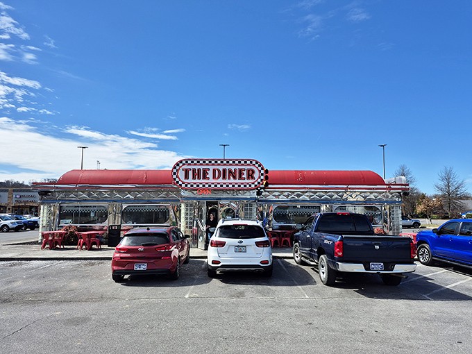 Chrome gleaming under Tennessee sunshine, The Diner's iconic red roof and checkerboard sign promise a time-traveling feast that delivers on nostalgia and flavor alike.