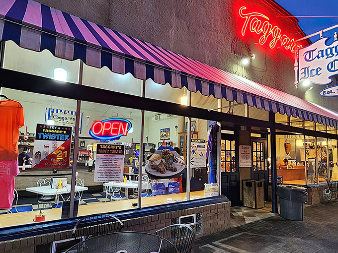 The neon glow of Taggarts beckons like a lighthouse for the sweet-toothed, promising salvation under those classic blue and white awnings.