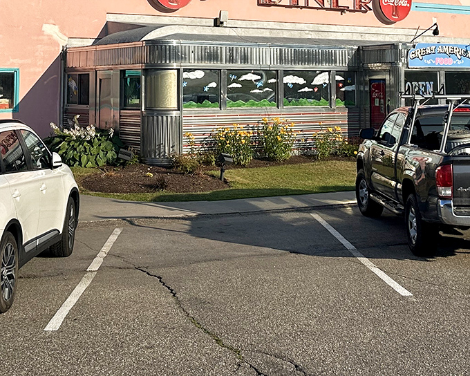 The gleaming stainless steel exterior of Tilt'n Diner beckons hungry travelers like a chrome time capsule of American comfort food.