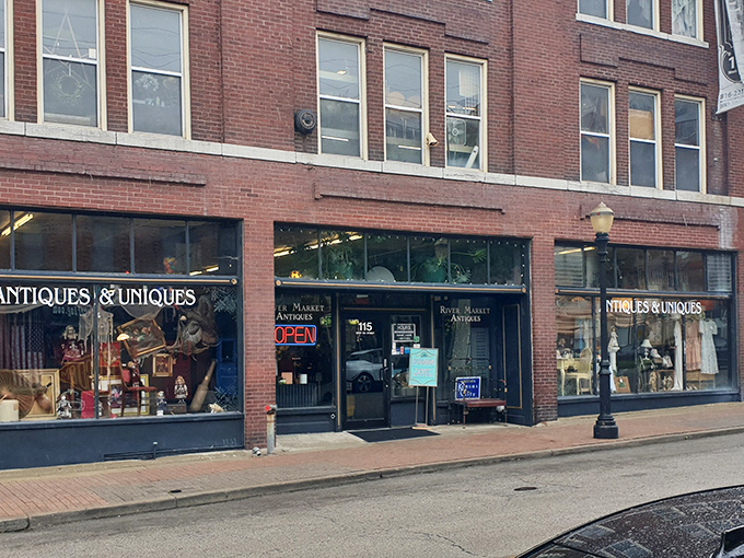 The unassuming storefront of River Market Antiques beckons with its classic neon "OPEN" sign&mdash;a portal to treasures spanning decades of American life.