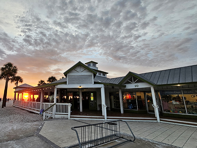 Sunset magic at Palm Pavilion, where the golden hour transforms this beachside eatery into a postcard-perfect scene worthy of your vacation slideshow.