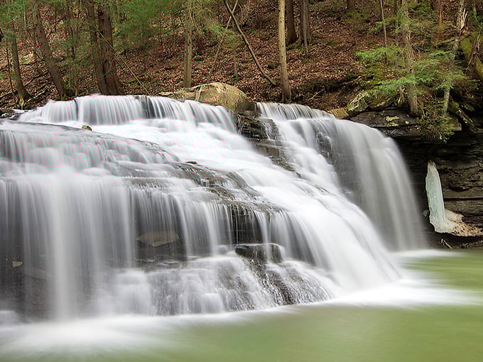 The silky white waters of Freedom Falls create nature's perfect soundtrack as they tumble down the rock face into the emerald pool below.