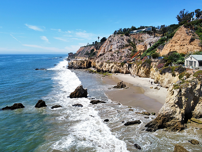 Nature's own sculpture garden where golden cliffs meet azure waters. El Matador's iconic rock formations stand like sentinels guarding California's most photogenic shoreline.
