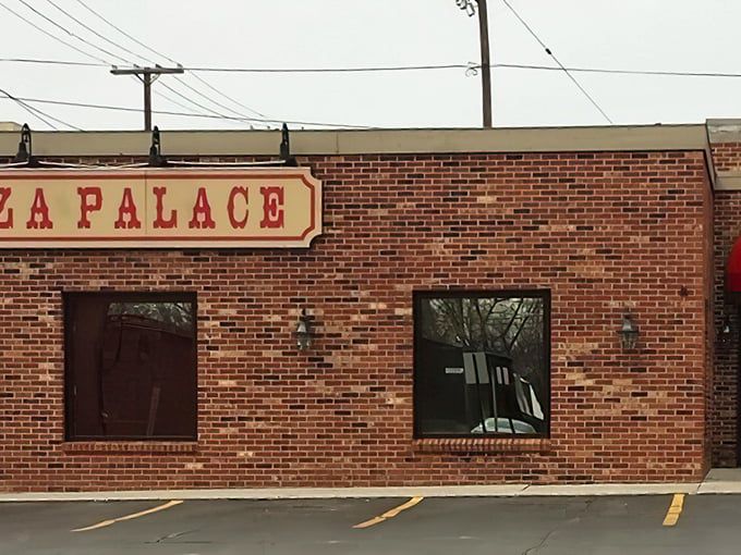 The brick facade of Fort Ball Pizza Palace stands as a testament to Tiffin's enduring love affair with no-nonsense, delicious pizza.