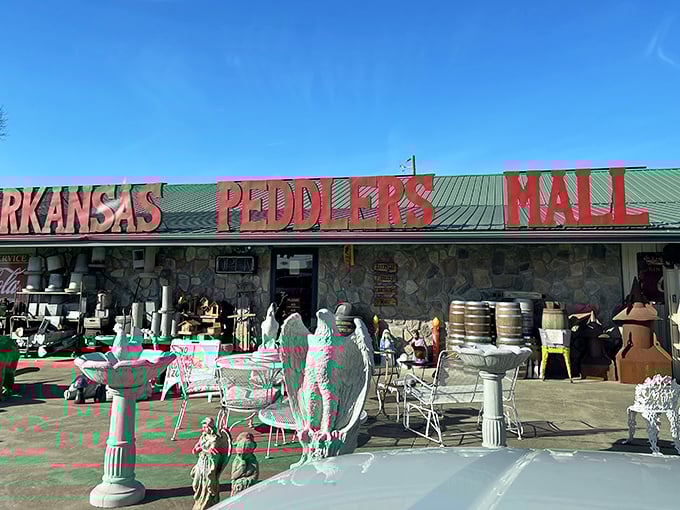 Under clear blue Arkansas skies, concrete eagles and garden statuary stand guard outside this temple of nostalgia, hinting at the wonderland waiting within.