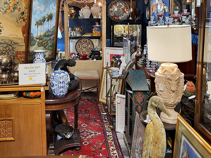 Narrow pathways wind between treasures at Treasure Island Antiques, where every inch tells a story and Oriental rugs guide your adventure.