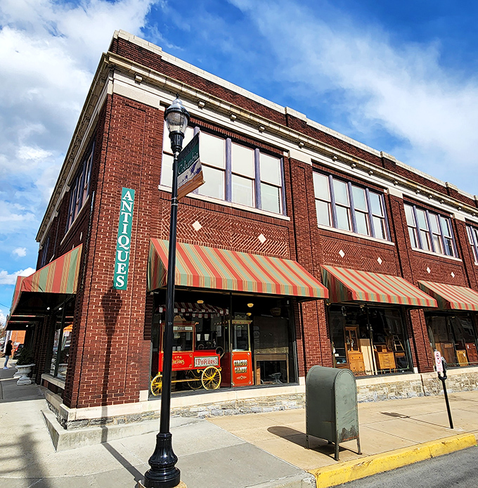 The historic brick fa&ccedil;ade of Burning Bridge Antique Market stands proudly in Columbia, its colorful awnings beckoning vintage hunters like a siren song for the nostalgic soul.