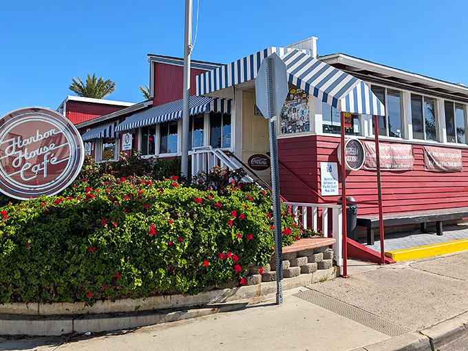 Harbor House's cheerful fa&ccedil;ade stands like a culinary lighthouse on PCH, beckoning hungry travelers with the promise of comfort food salvation.