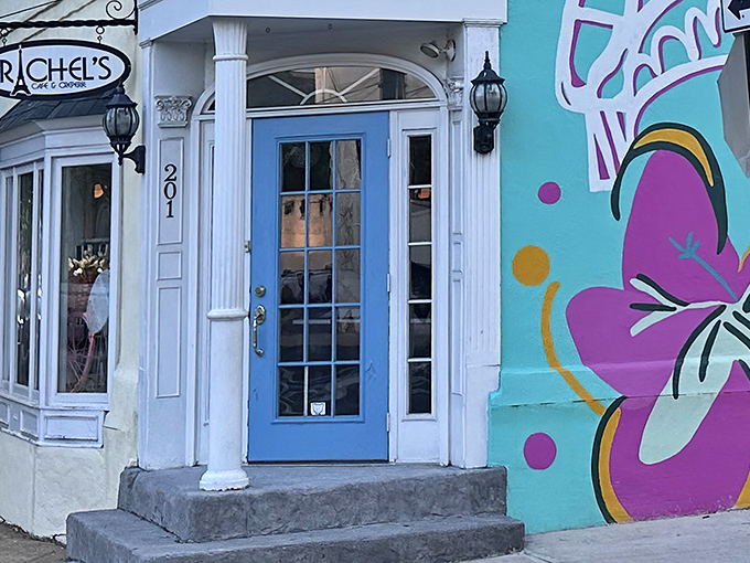 That iconic blue door isn't just an entrance&mdash;it's a portal to crepe paradise. The colorful mural beside it hints at the creativity waiting inside.