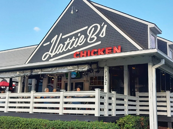 The black-and-white facade with that bold red "CHICKEN" sign isn't just architecture&mdash;it's Nashville's equivalent of a lighthouse guiding hungry souls to spicy salvation.