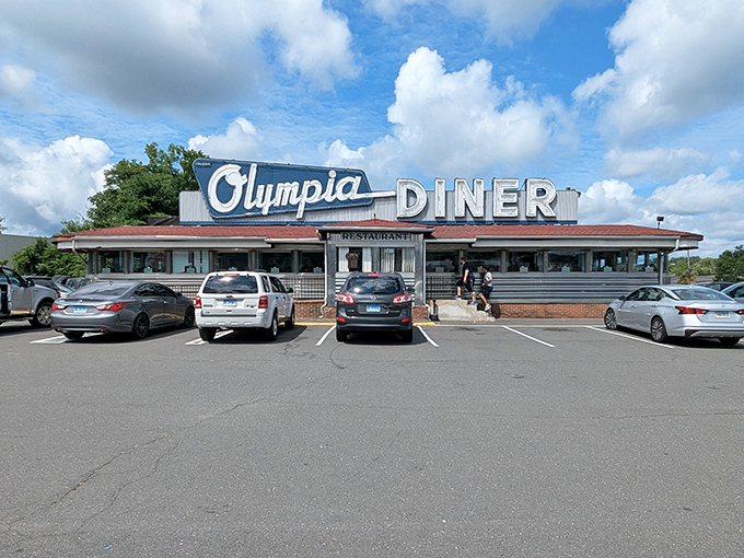 The gleaming stainless steel exterior of Olympia Diner stands proudly against Connecticut's sky, a chrome time capsule serving happiness since long before Instagram food pics.