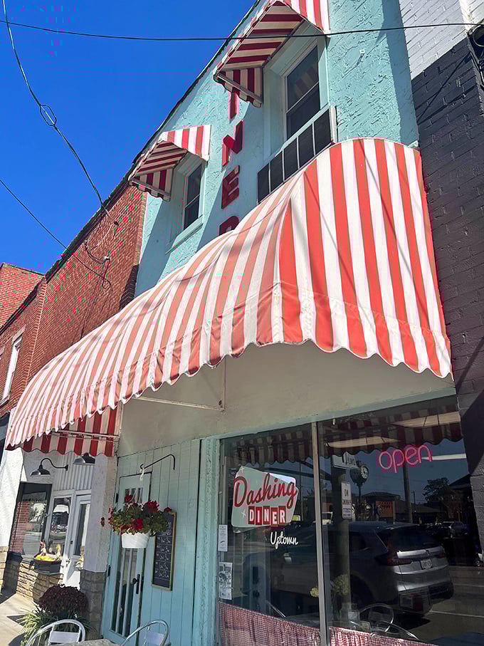 That mint-green facade with candy-striped awnings isn't just eye-catching&mdash;it's a time machine disguised as a diner in downtown Johnstown.