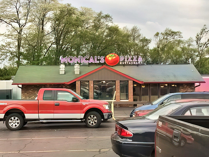 The iconic red-roofed Monical's with its cheerful tomato sign beckons hungry travelers like a pizza lighthouse in a sea of chain restaurants.