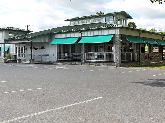 Architectural charm meets culinary promise at The Pizza Grille, where the stone accents and welcoming entrance say "come hungry, leave happy" before you even step inside.