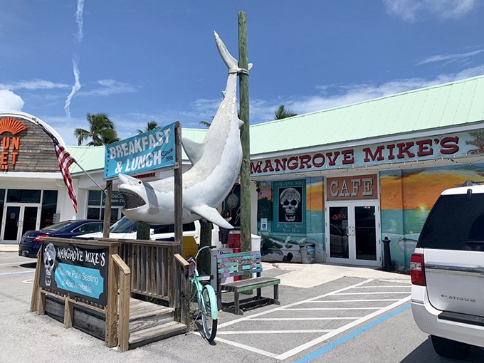 That giant shark statue isn't compensating for anything—Mangrove Mike's food is every bit as impressive as its toothy greeter.