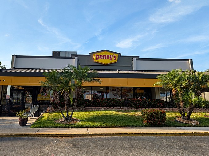 The iconic yellow sign beckons like a lighthouse for hungry travelers on International Drive, promising comfort food and air conditioning &ndash; Florida's true treasures.