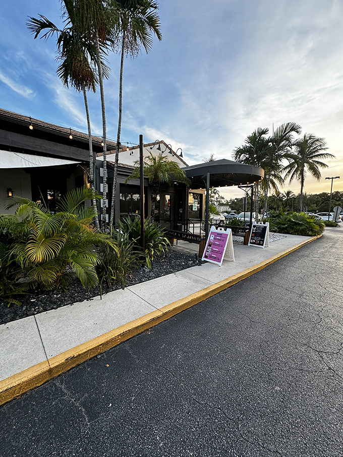 Palm trees stand sentinel outside Bimini Twist, where Florida's tropical charm meets culinary excellence. The perfect prelude to seafood paradise.