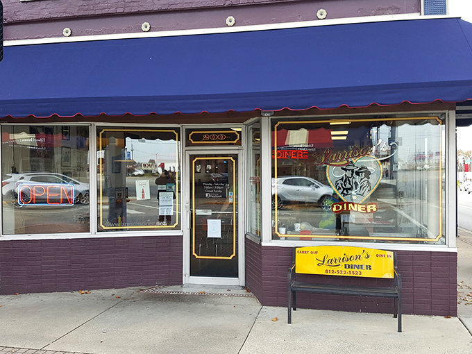 The purple storefront with royal blue awning isn't just a diner&mdash;it's a time machine disguised as Larrison's, waiting to transport you to breakfast nirvana.