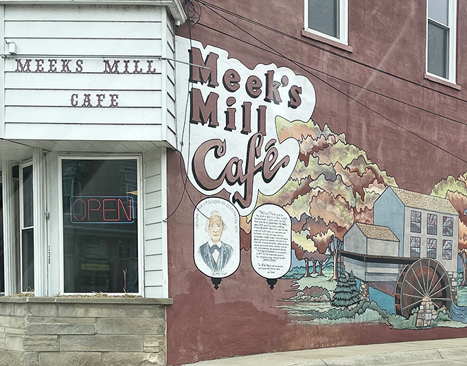 This charming exterior mural tells Constantine's story while promising culinary adventures that await inside.