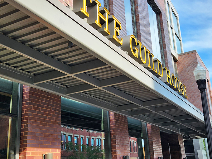 The golden letters of The Guild House shine like a culinary beacon in Columbus's Short North district, promising extraordinary flavors behind that brick fa&ccedil;ade.