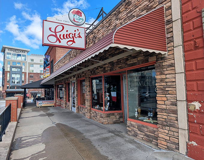 Luigi's iconic storefront stands as a beacon of Italian comfort in downtown Akron, its vintage sign promising culinary traditions that have endured for generations.