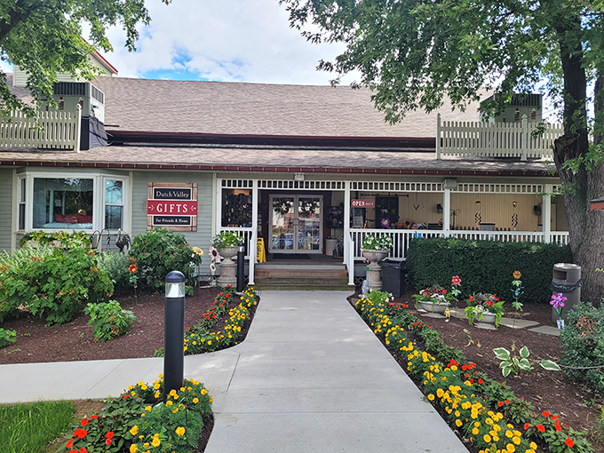 The welcoming front porch of Dutch Valley beckons like an old friend, complete with colorful flower beds that seem to say, "Come on in, the pie's waiting!"