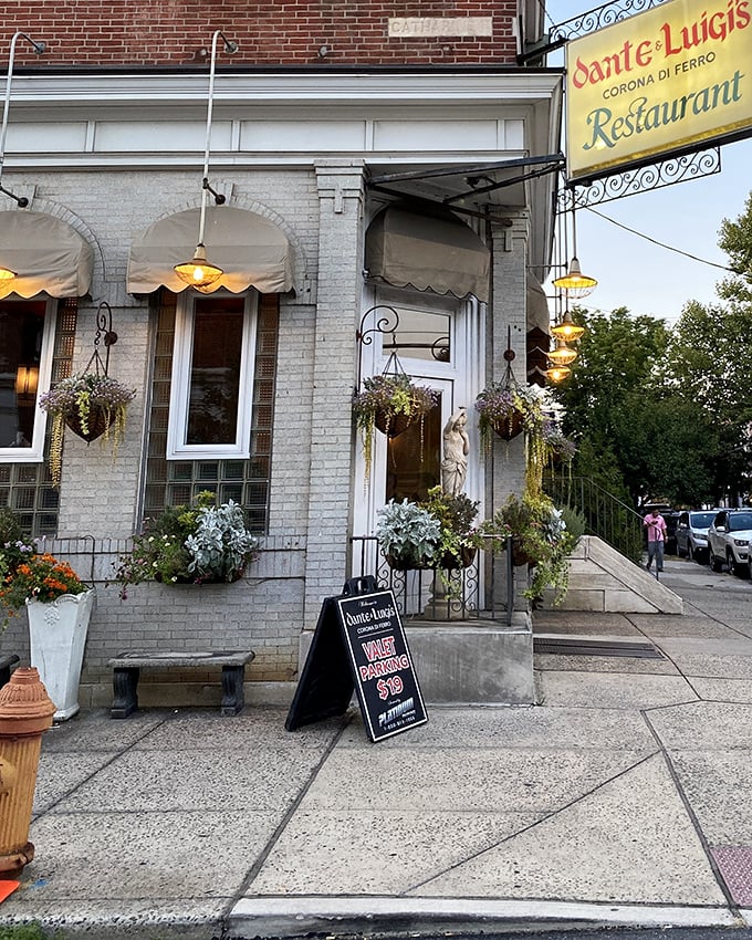 A closer look at the entrance reveals meticulous details&mdash;hanging plants, warm lighting, and a welcoming bench that says, "Sit a while, what's the rush?"