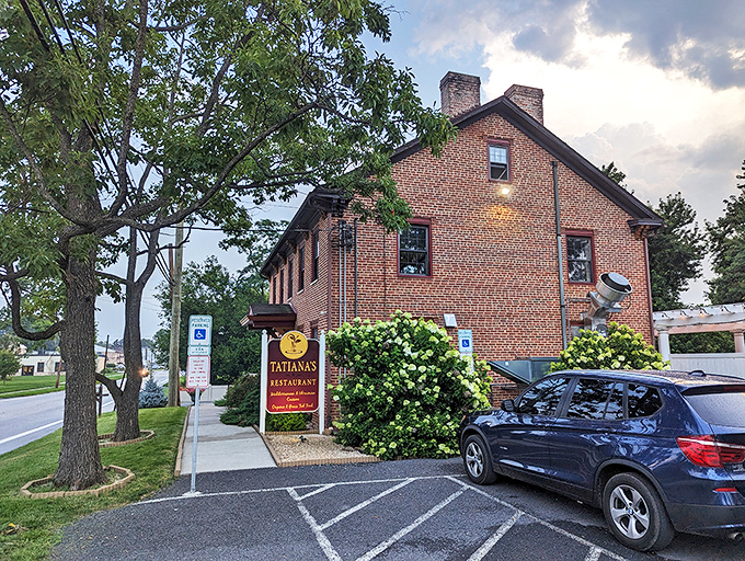 Tatiana's burgundy sign against classic brick architecture creates the perfect first impression&mdash;like finding a European postcard come to life in central Pennsylvania.